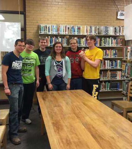 Students repair library's tables - Great Bend Tribune