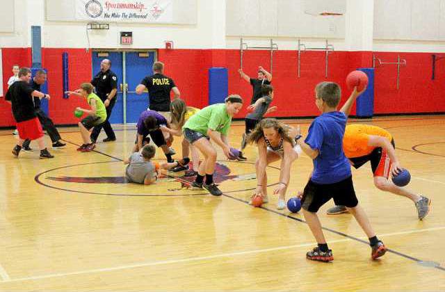 Ellinwood kids versus cops in dodgeball match - Great Bend Tribune