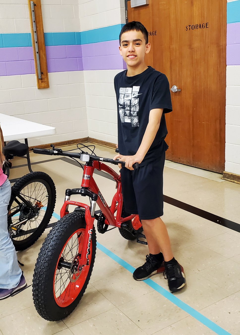 Community members award wheels for school attendance - Great Bend Tribune